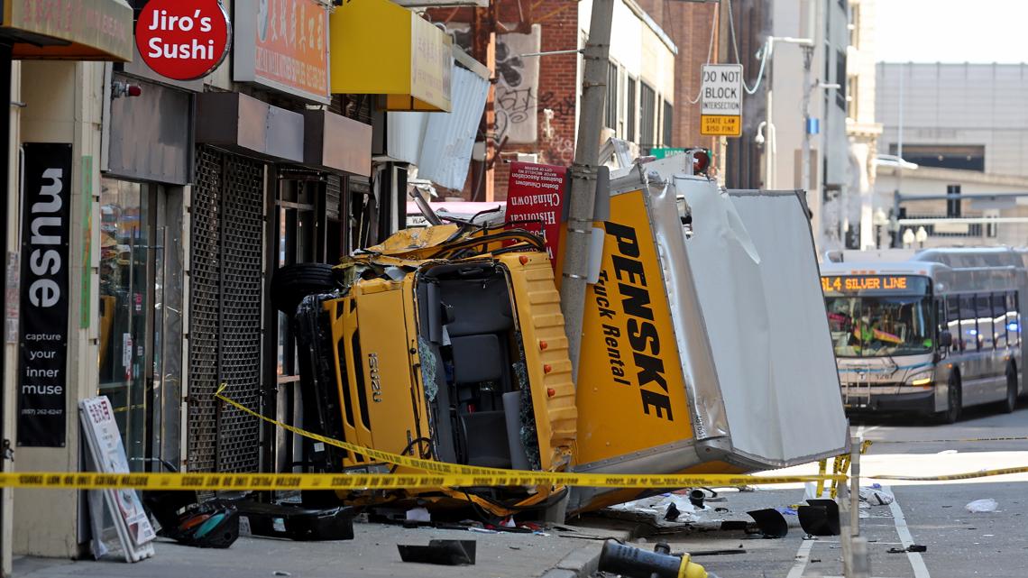 Box truck crashes into building, injuring 6 in Boston | cbs8.com