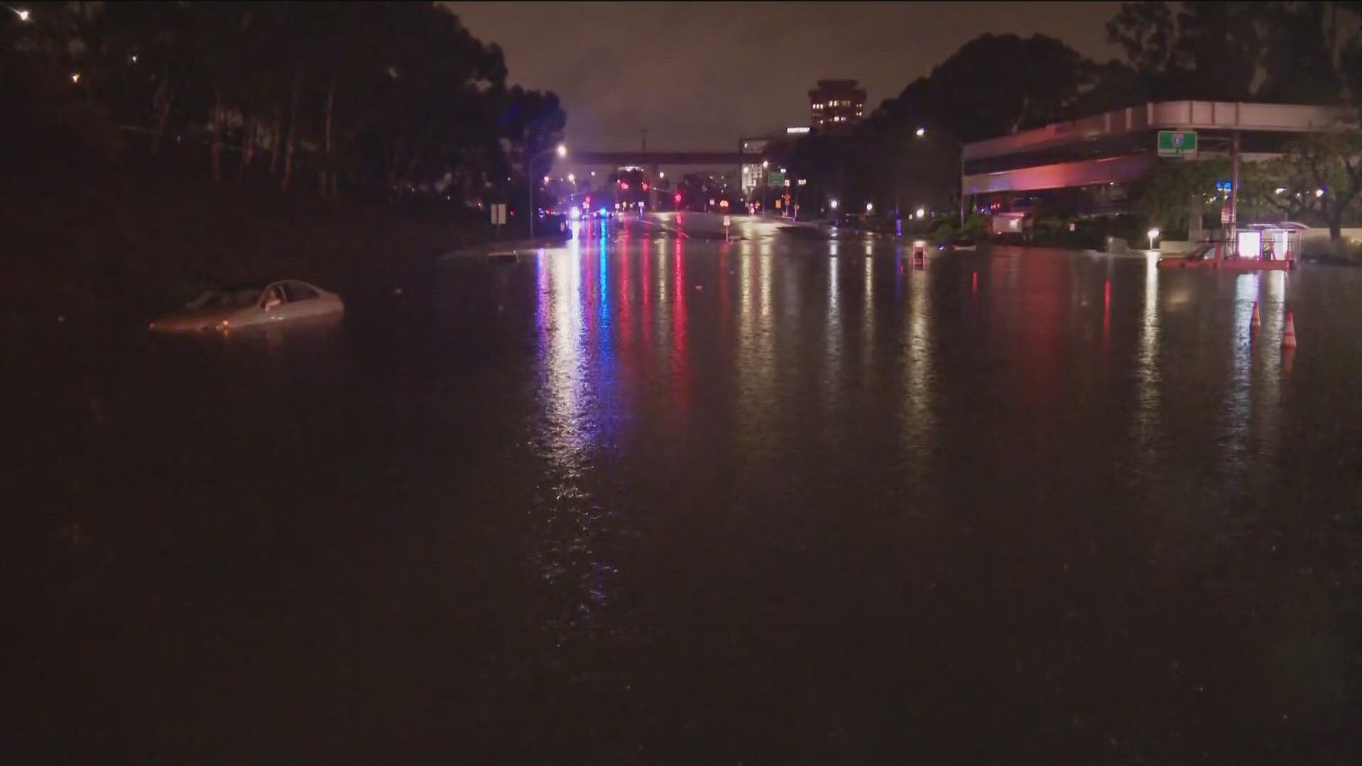 Cars submerged, people rescued at flooded intersections in San Diego ...