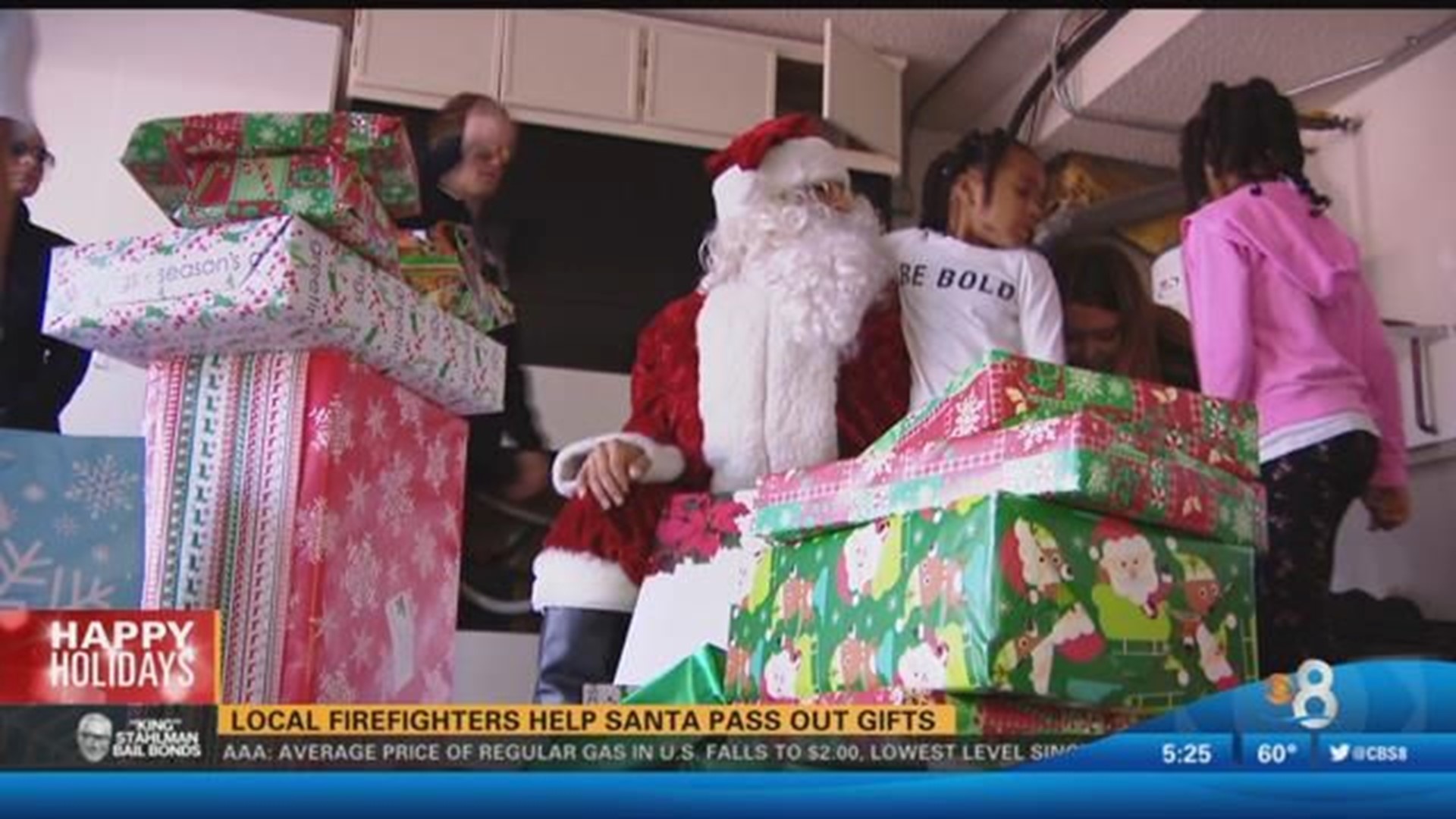 Local firefighters help Santa pass out gifts | cbs8.com