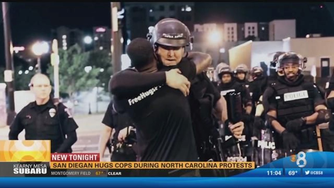 Chula Vista man hugs police during North Carolina protests | cbs8.com