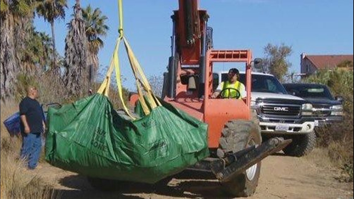 Crews clean up notorious homeless camp | cbs8.com
