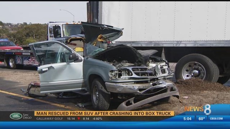 Man rescued from SUV after crashing into box truck | cbs8.com