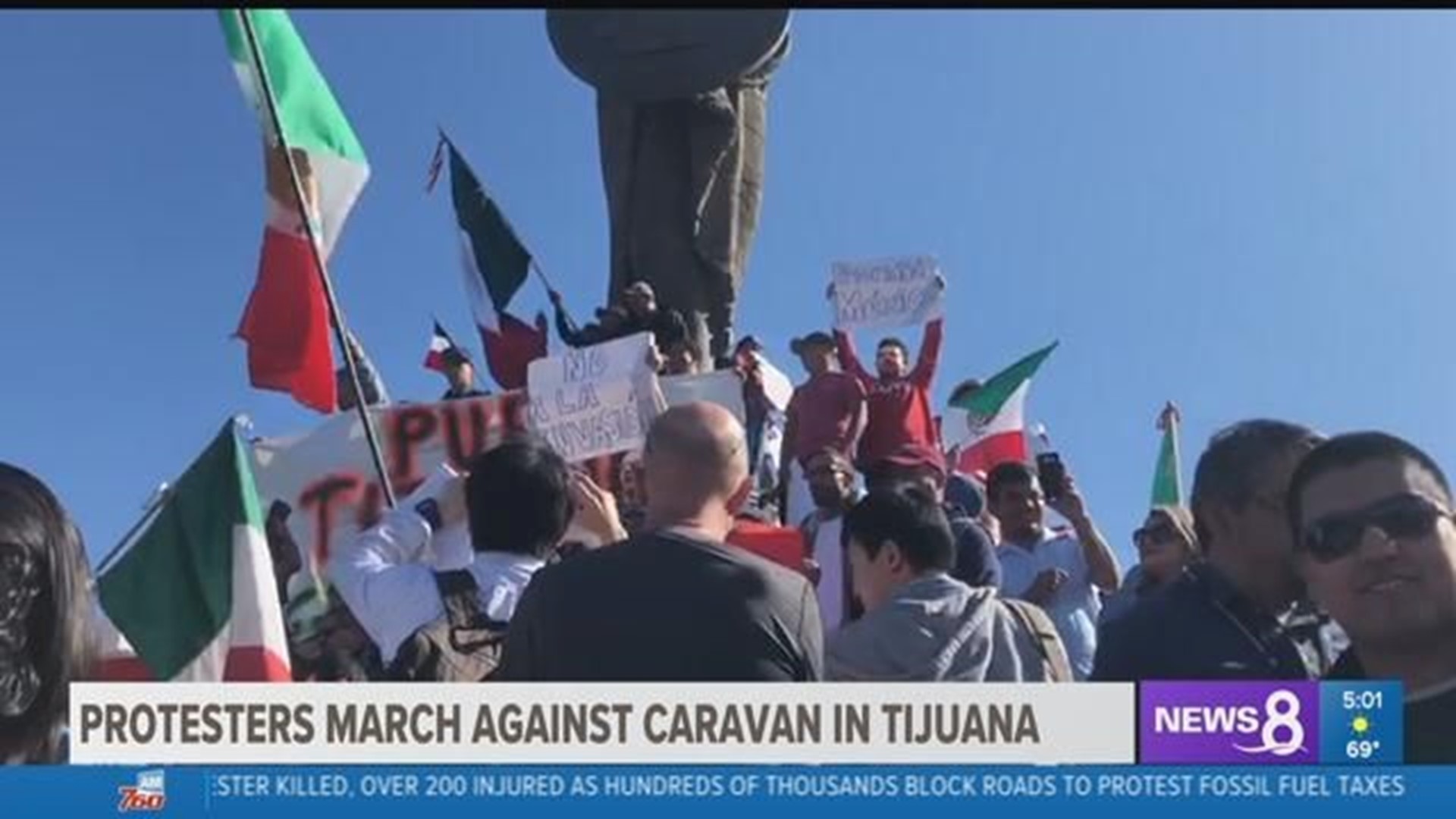 Protesters march against migrant caravan in Tijuana | cbs8.com