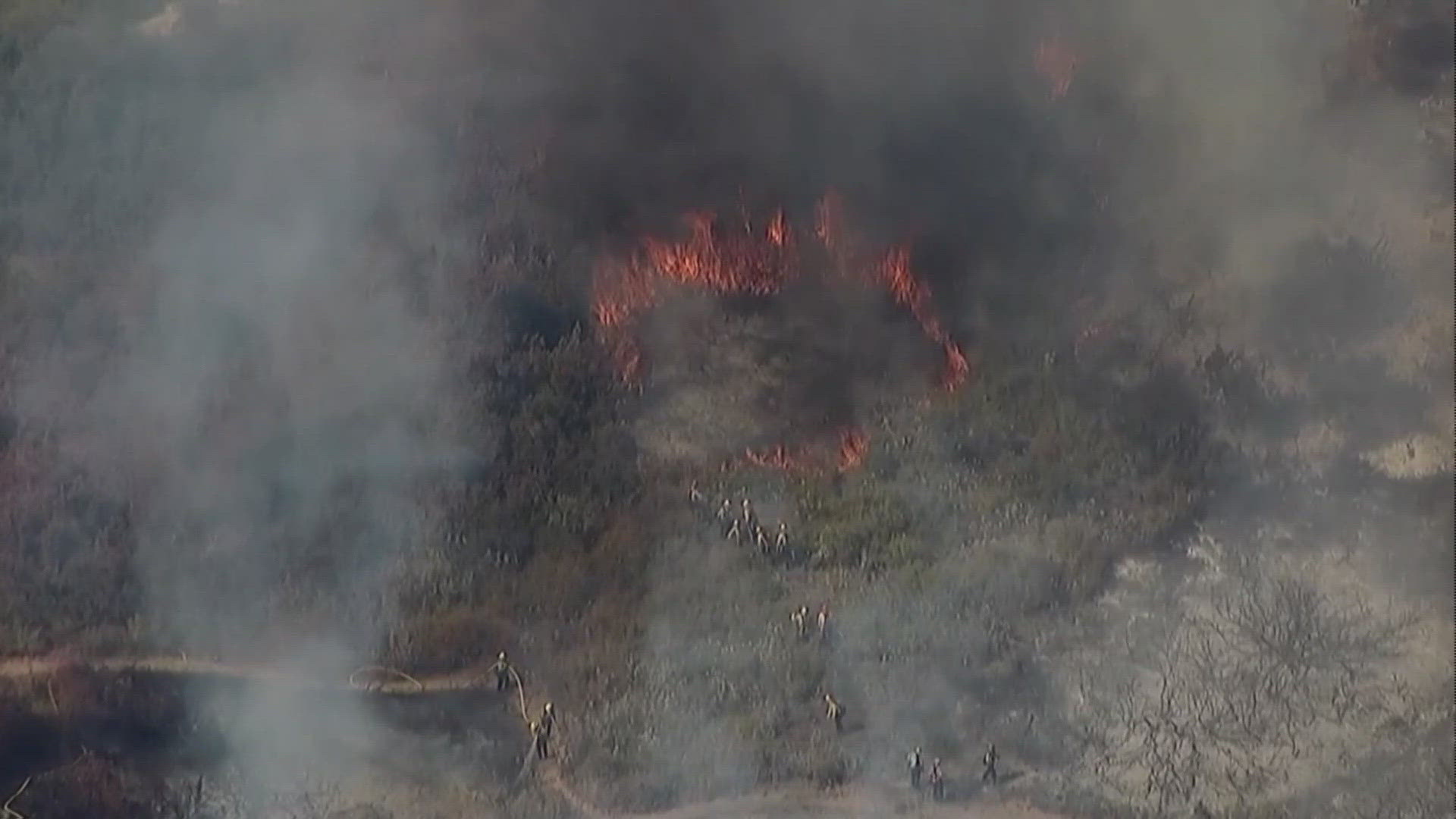 Fire crews battle a Del Mar brush fire from the air and on the ground ...