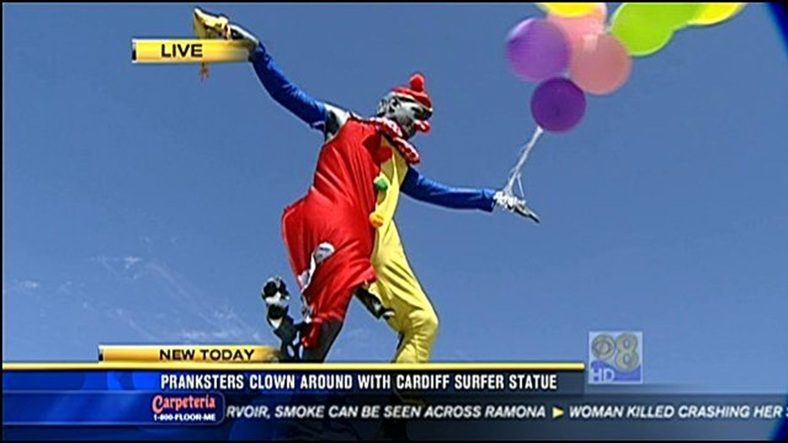 Pranksters clown around with Cardiff surfer statue | cbs8.com