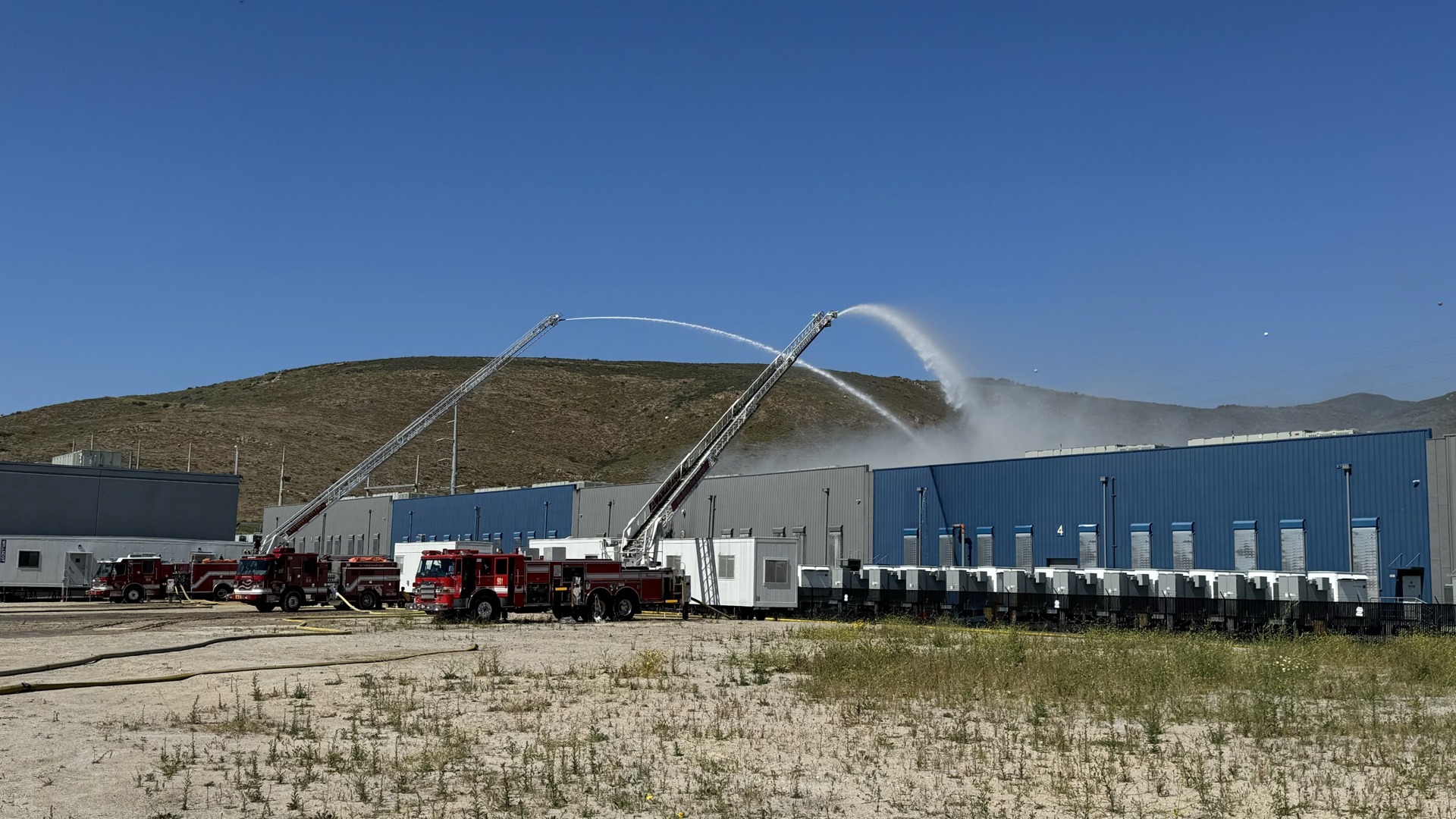 Battery storage facility fire under control, still burning | cbs8.com