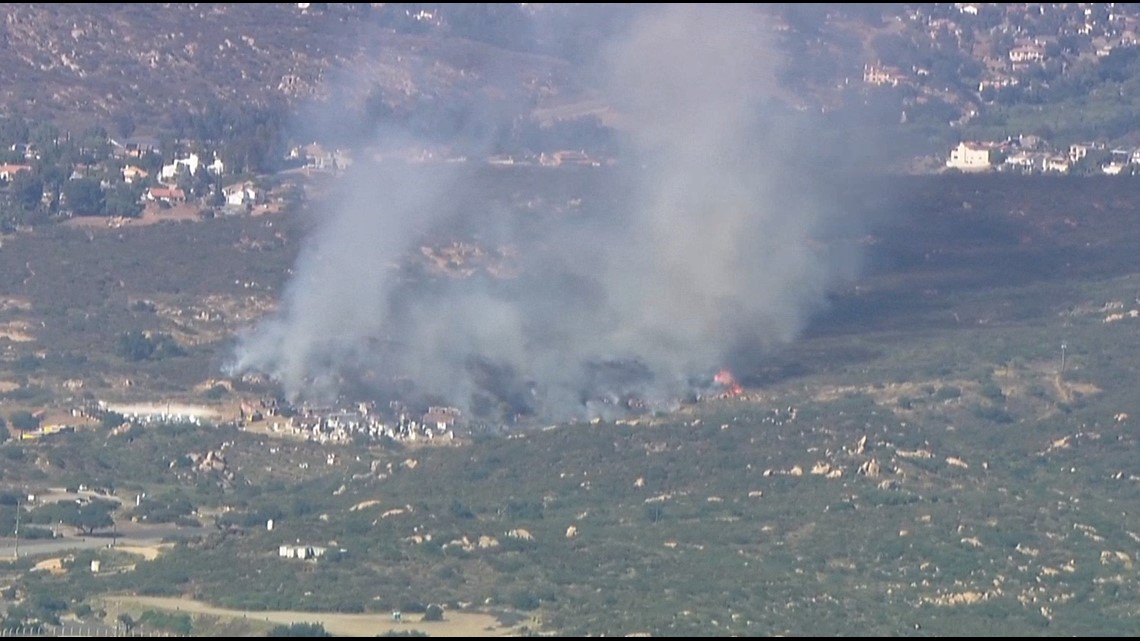 Brush fire burns 20 acres in Barona, evacuation warnings lifted | cbs8.com