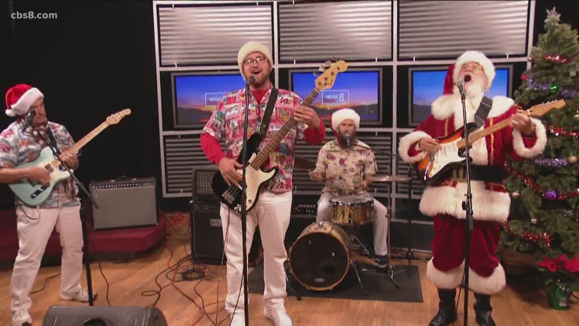 Rockin' around the Christmas tree with the Surfin' Santa Band | cbs8.com