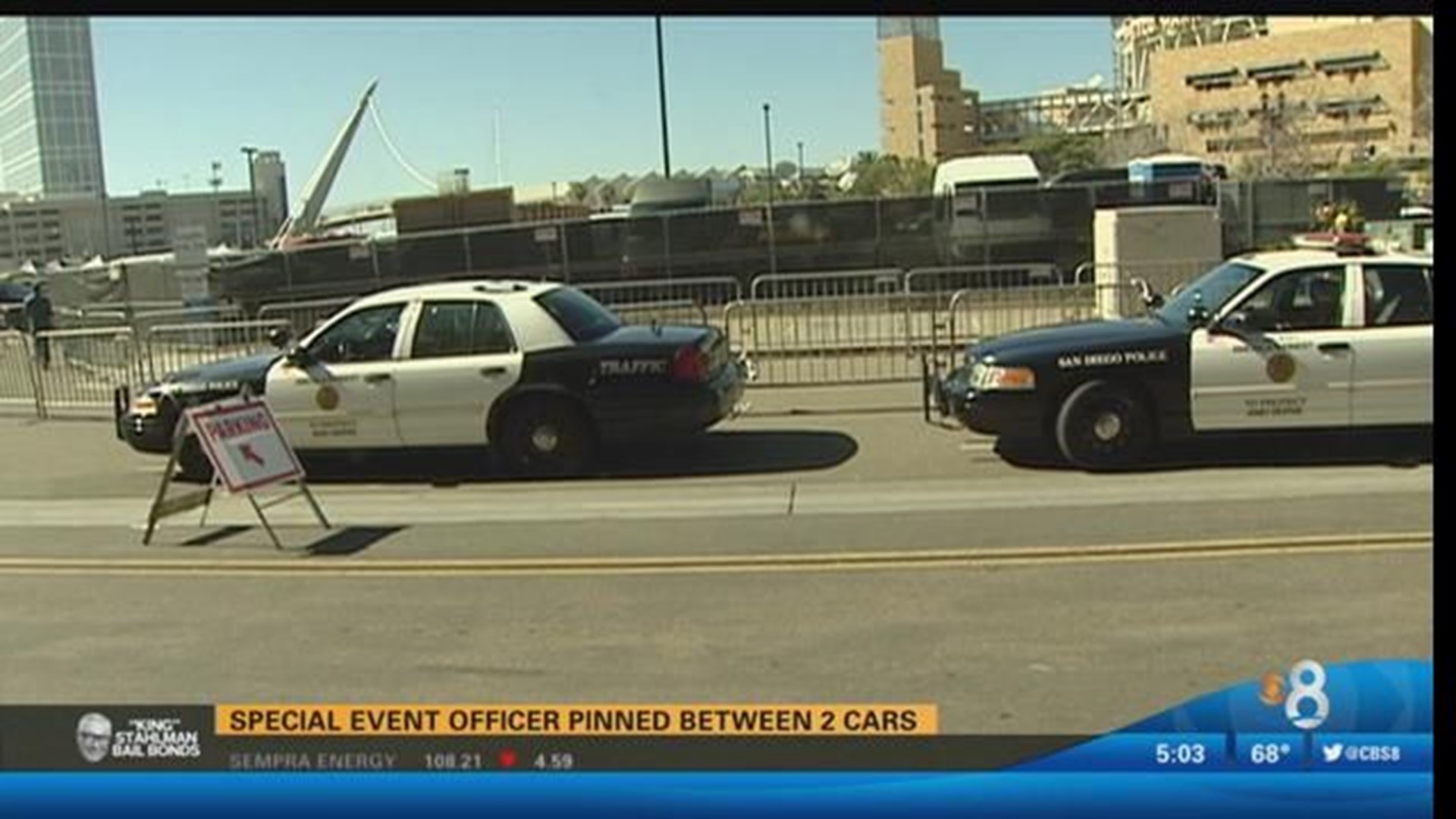Parking enforcement officer pinned between two cars | cbs8.com