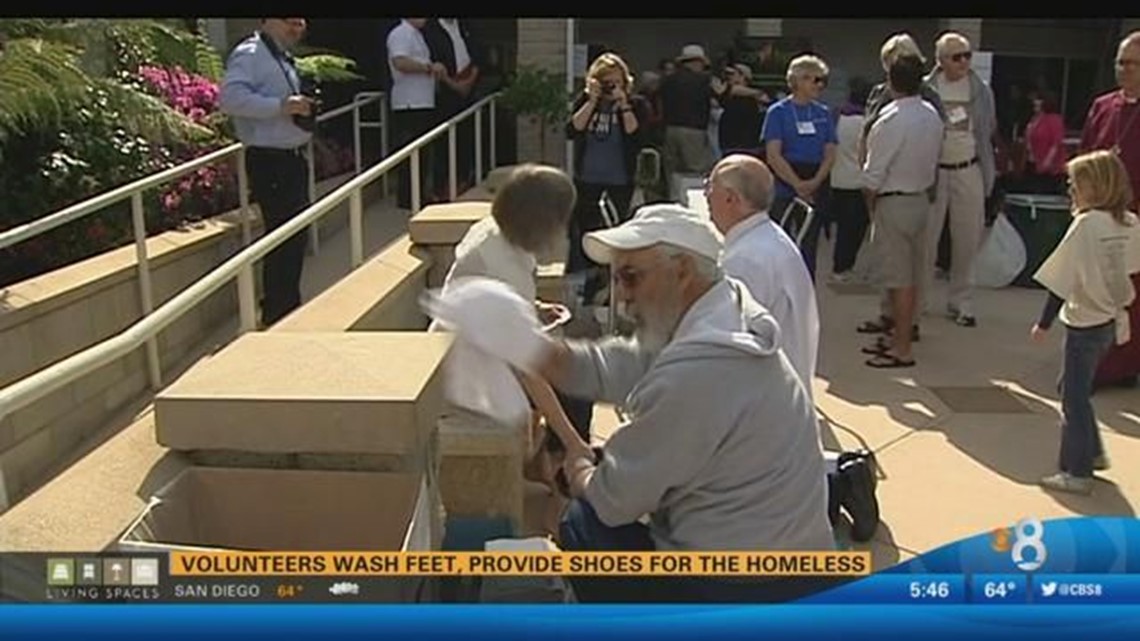 Volunteers wash feet, provide shoes for the homeless | cbs8.com