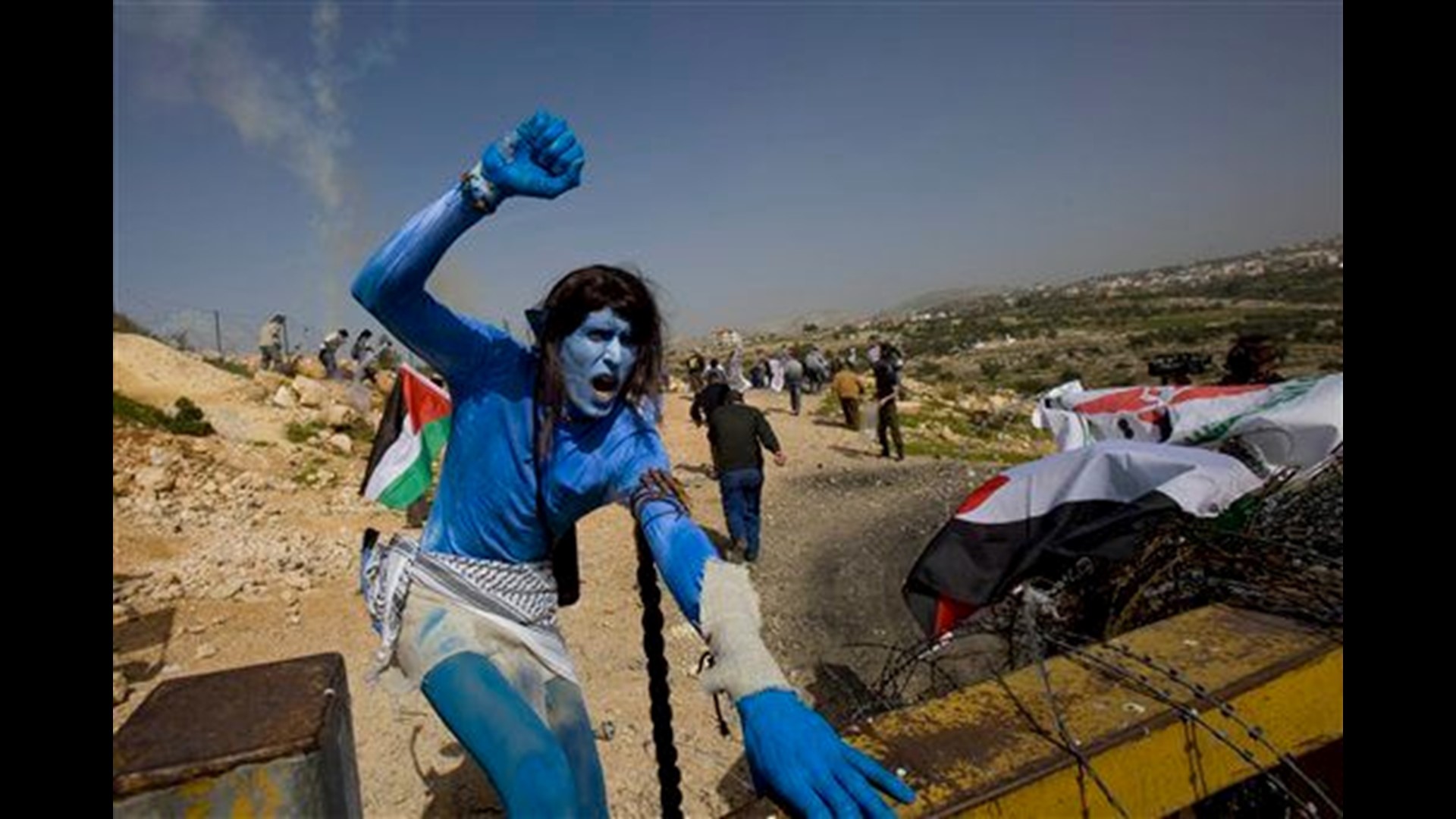 Palestinian protesters pose as Na'vi from "Avatar" | cbs8.com