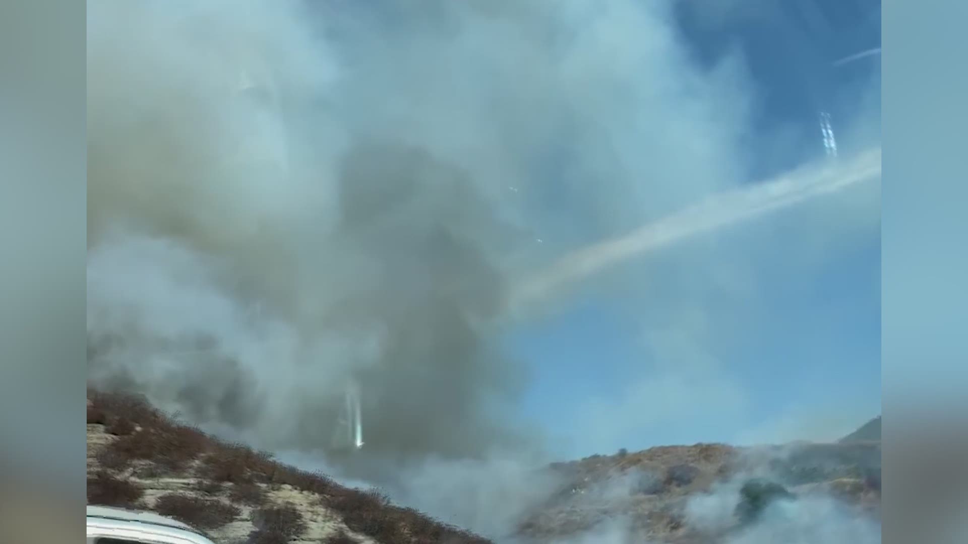 Cal Fire crews mop-up a 3 acre fire along the I-15 freeway in Fallbrook ...