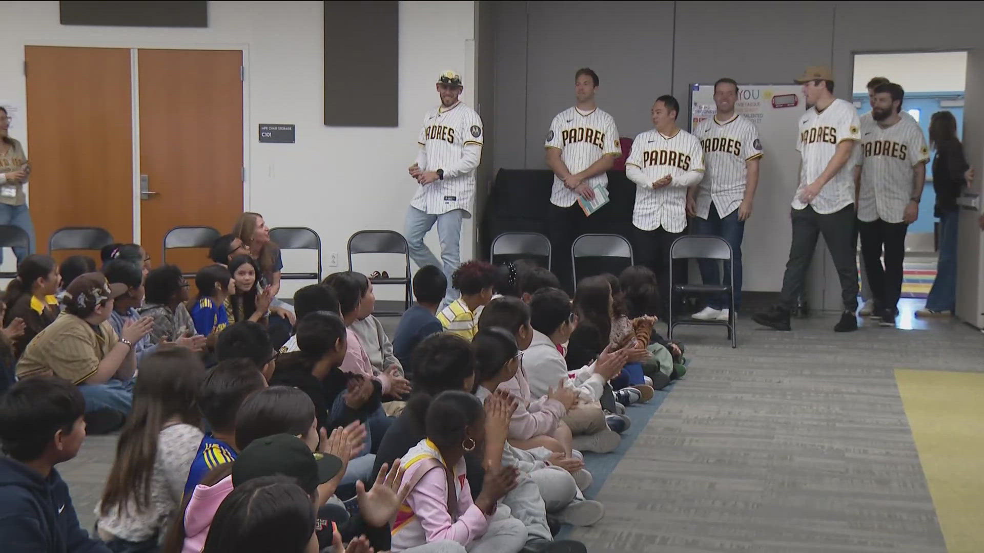 San Diego Padres surprise students and seniors with books during ...