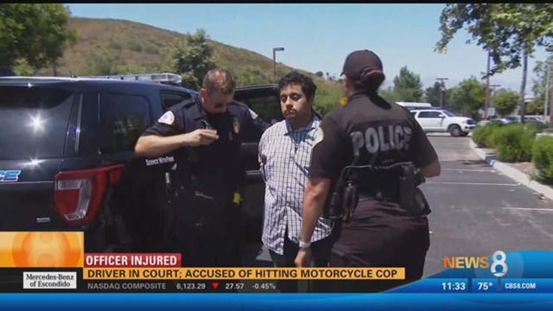 Driver accused of hitting motorcycle cop ordered to stand trial | cbs8.com
