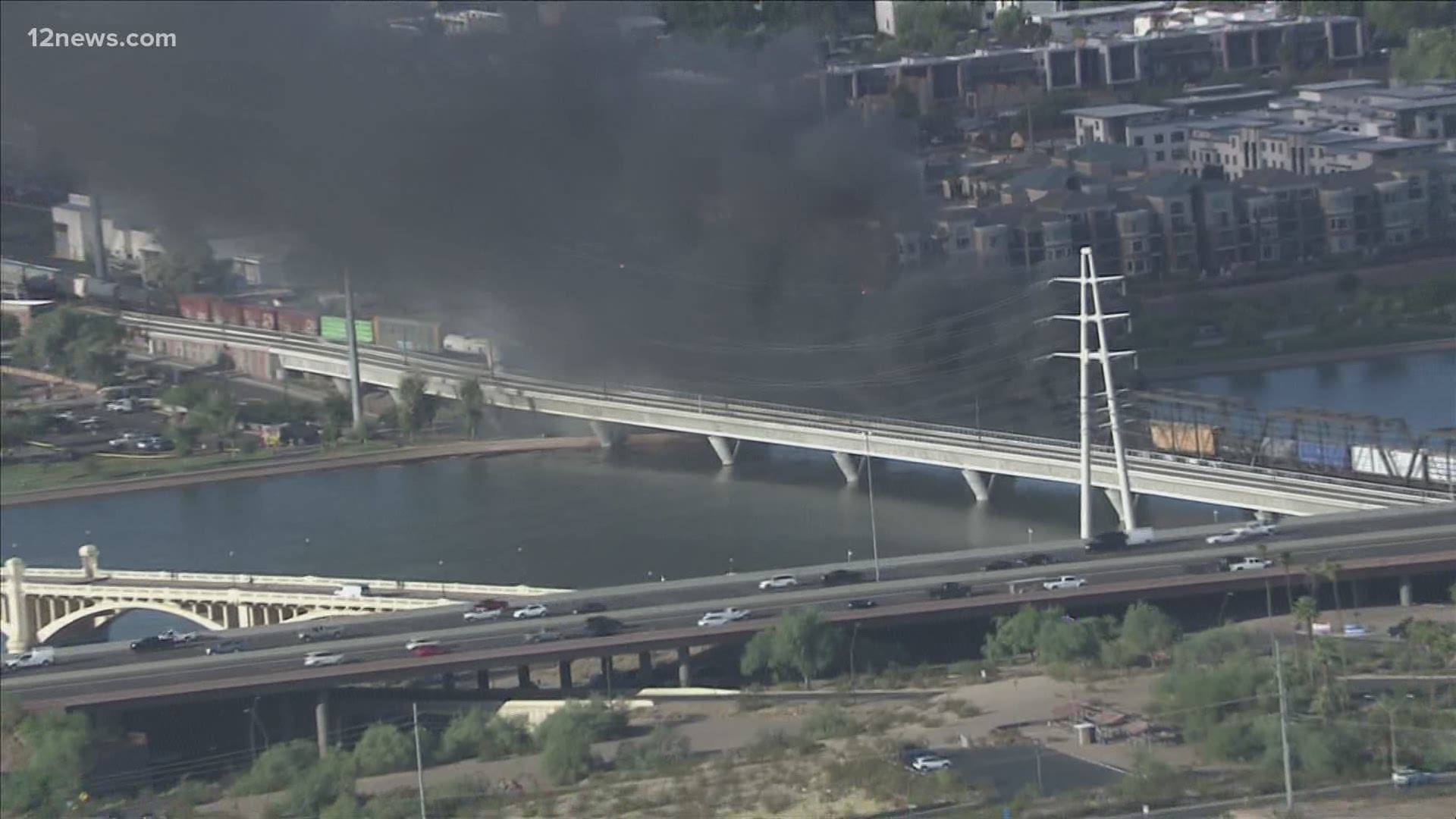 Fire crews battle train derailment, massive fire at Tempe Town Lake ...